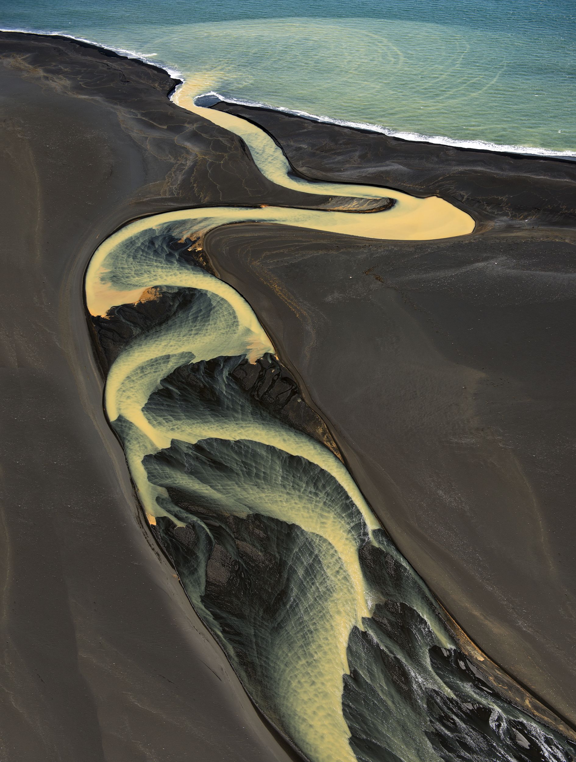 An aerial view over a section of river delta, Iceland.